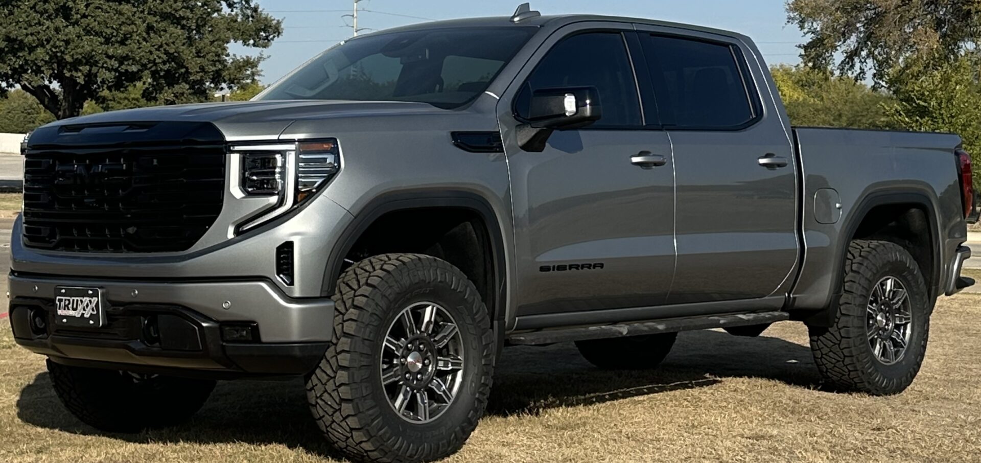 Bold, Silver & Sleek: The 2024 GMC Sierra SLT with Full Chrome Delete ...