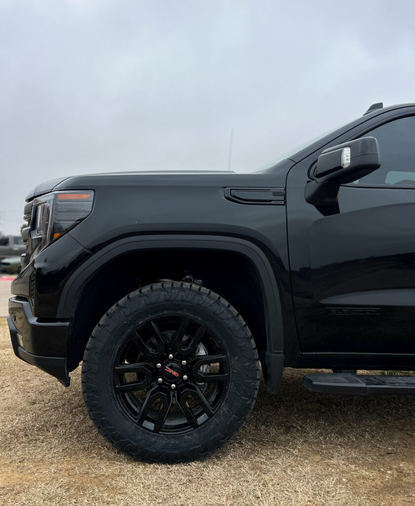 Fearlessly Upgraded: GMC Sierra Built with a Level Lift, Blackout ...